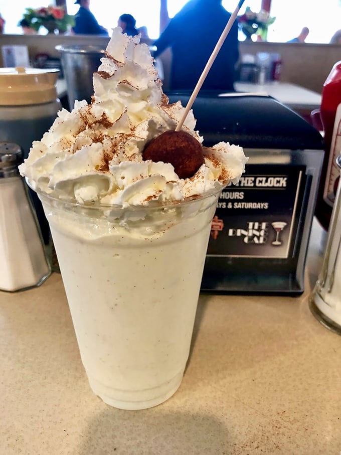 This isn't just a milkshake—it's a commitment. The whipped cream tower demands respect and a dedicated strategy.