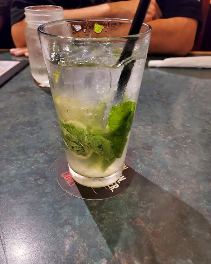 A mojito with fresh mint that offers a moment of refreshing clarity amid the smoky, savory barbecue storm – like finding an oasis in a delicious desert.