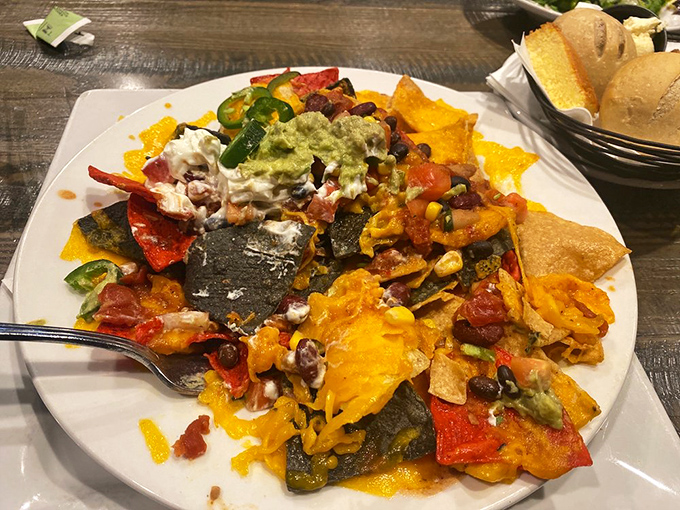 Nachos that require a strategy session before eating—each chip a delivery vehicle for maximum flavor payload.