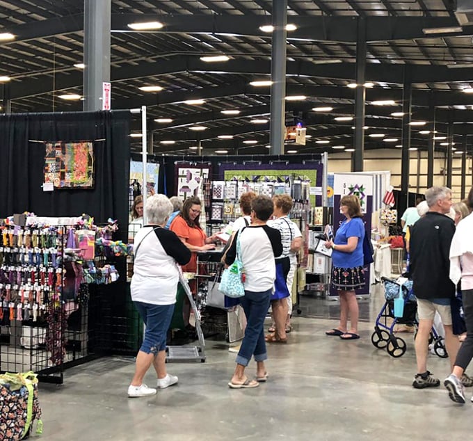 Craft meets commerce in the festival hall, where quilts aren't just bedcovers but stories stitched into fabric by patient hands.