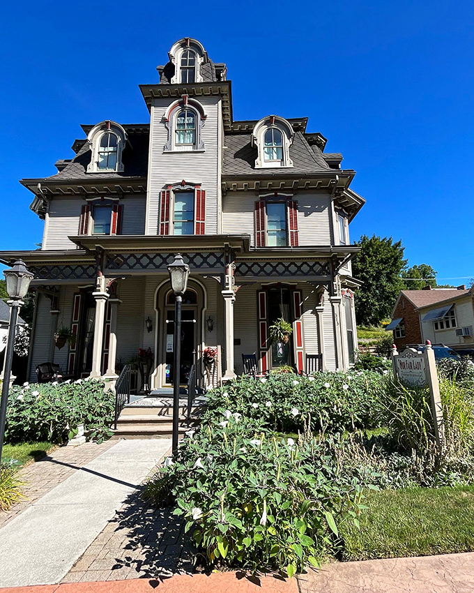 Victorian homes like this weren't built to blend in—they were architectural peacocks showing off intricate details and distinctive silhouettes.