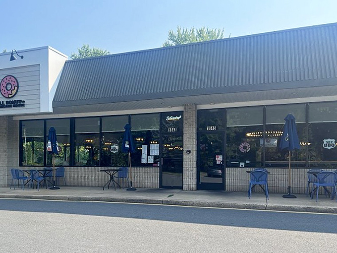 Al fresco dining, Delaware style. These blue chairs aren't just seating—they're front-row tickets to people-watching while you savor your breakfast masterpiece.