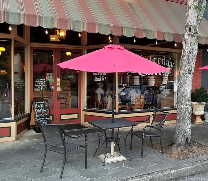 Outdoor seating under pink umbrellas—because buttermilk pie tastes even better with a side of fresh Georgia air and people-watching.
