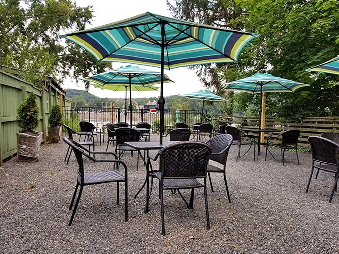 The outdoor seating area offers a peaceful retreat with striped umbrellas. Ice cream always tastes better with a side of fresh air.