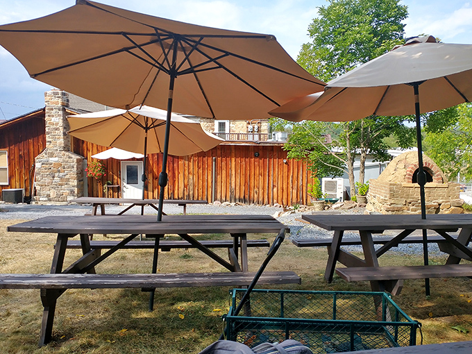 Outdoor dining that makes you want to linger until sunset. Those umbrellas aren't just for show—they're sheltering culinary happiness.