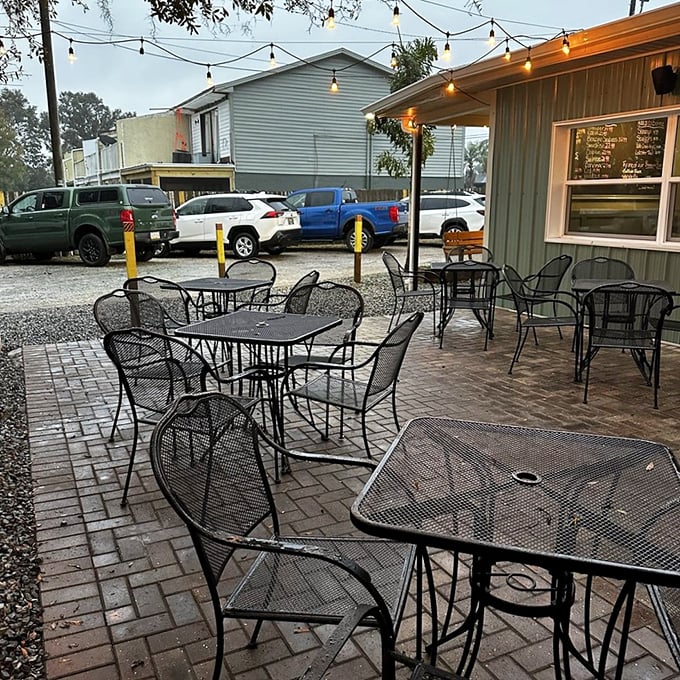 String lights transform the outdoor patio into a casual oasis—perfect for savoring seafood under the Florida evening sky. 