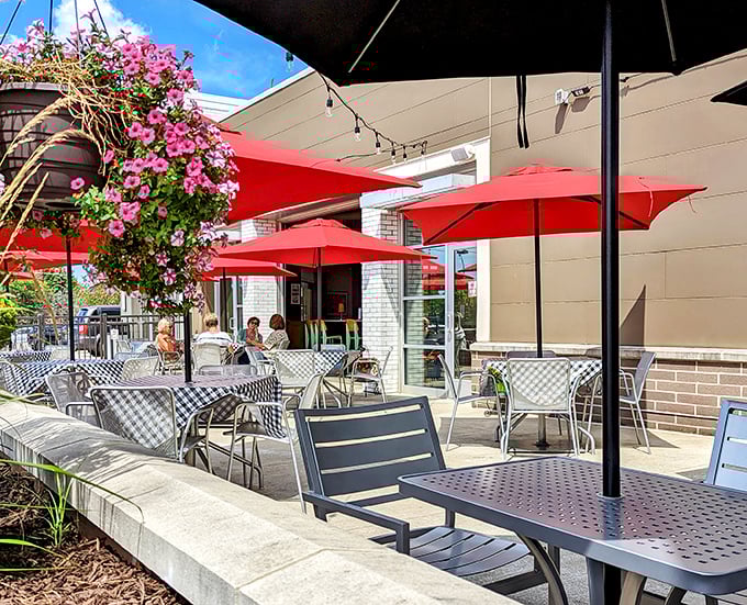 Ohio summers were made for this patio—red umbrellas, checkered tablecloths, and flowering plants creating an urban oasis for al fresco dining.