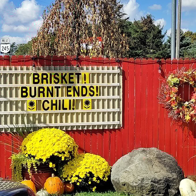 "Brisket! Burnt Ends! Chili!" – the roadside marquee equivalent of poetry. Those yellow mums are just showing off at this point.
