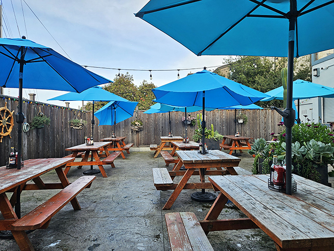 The outdoor patio with its blue umbrellas creates a perfect maritime mood. Even landlubbers feel connected to the sea while dining al fresco here.