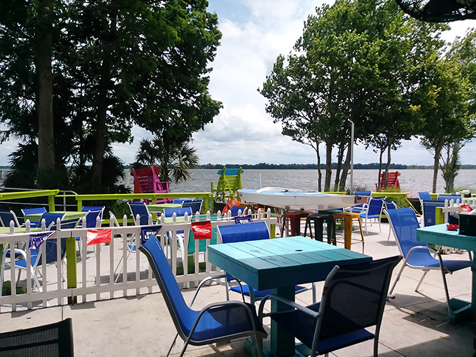 Colorful tables that match the vibrant water view—because in Florida, even the furniture knows it's supposed to make you smile.