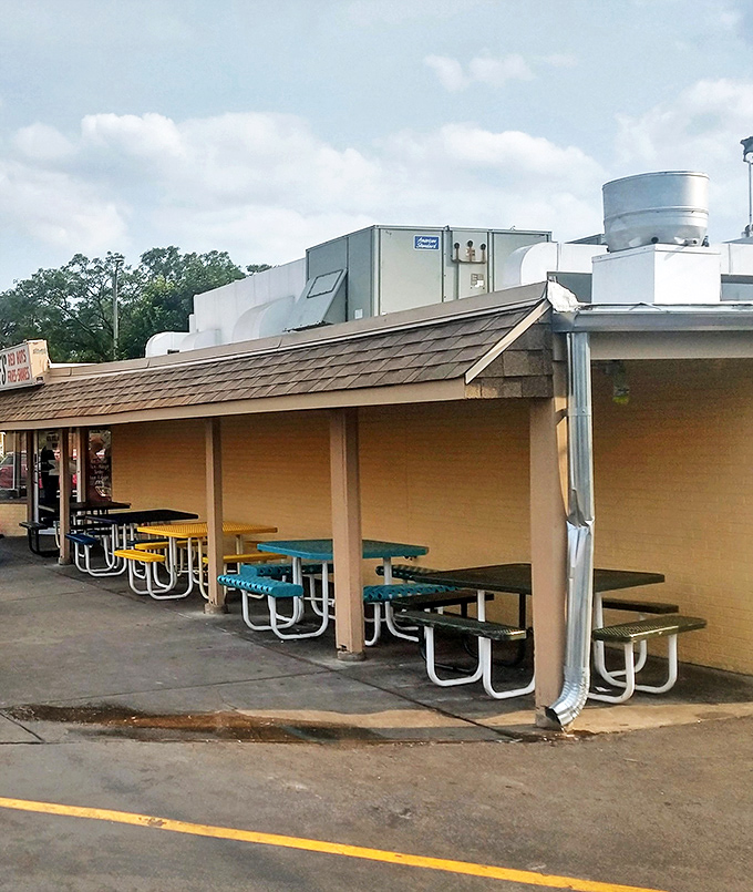 Outdoor seating at Johnnie's—where picnic tables become the great equalizer and everyone's united by the "lean forward" eating stance.