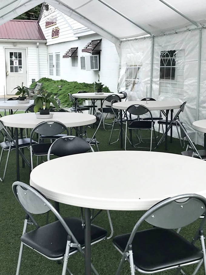 Outdoor seating under a tent offers a breath of fresh air with your meal—casual dining that feels like a backyard gathering with better food.