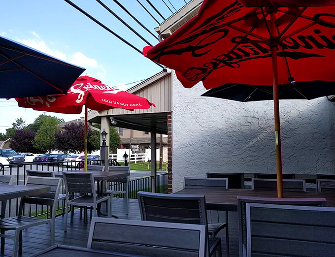 The outdoor seating area—where fresh air meets fresh food. Those red umbrellas aren't just for shade; they're beacons calling hungry travelers home.