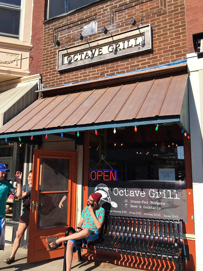The sidewalk bench offers a perfect perch for people-watching while waiting for your name to be called—burger anticipation at its finest.