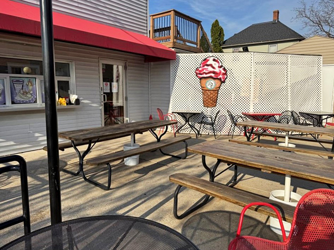 Outdoor seating with a giant ice cream cone watching over you—it's like dining under the benevolent gaze of a dairy deity.