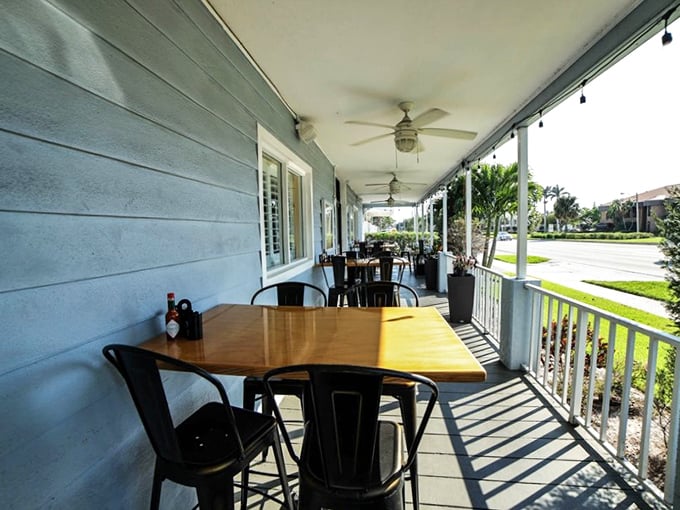 Porch seating where the Florida breeze enhances your coffee experience—nature's version of atmosphere enhancement.