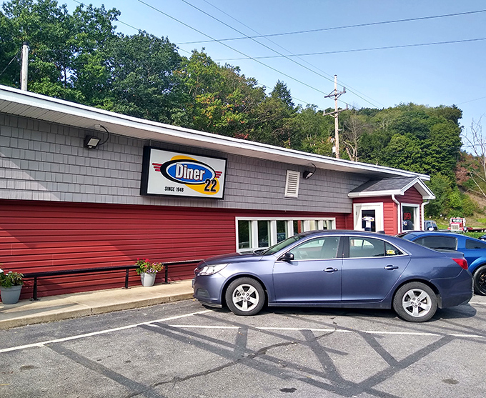 The parking lot – where anticipation builds on arrival and satisfied patrons waddle back to their cars, already planning return visits.