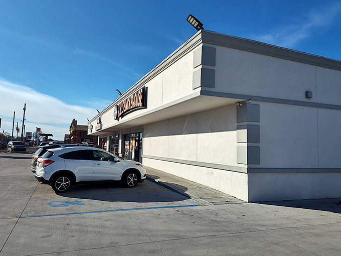 The parking lot—where anticipation begins and where you'll later waddle back to your car, happily defeated by portions that don't mess around.
