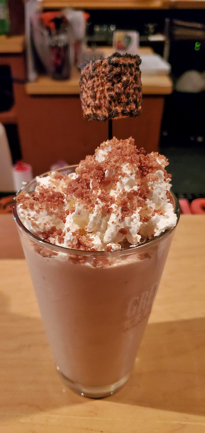 A towering milkshake topped with whipped cream and a toasted marshmallow – dessert that doubles as an Instagram celebrity.
