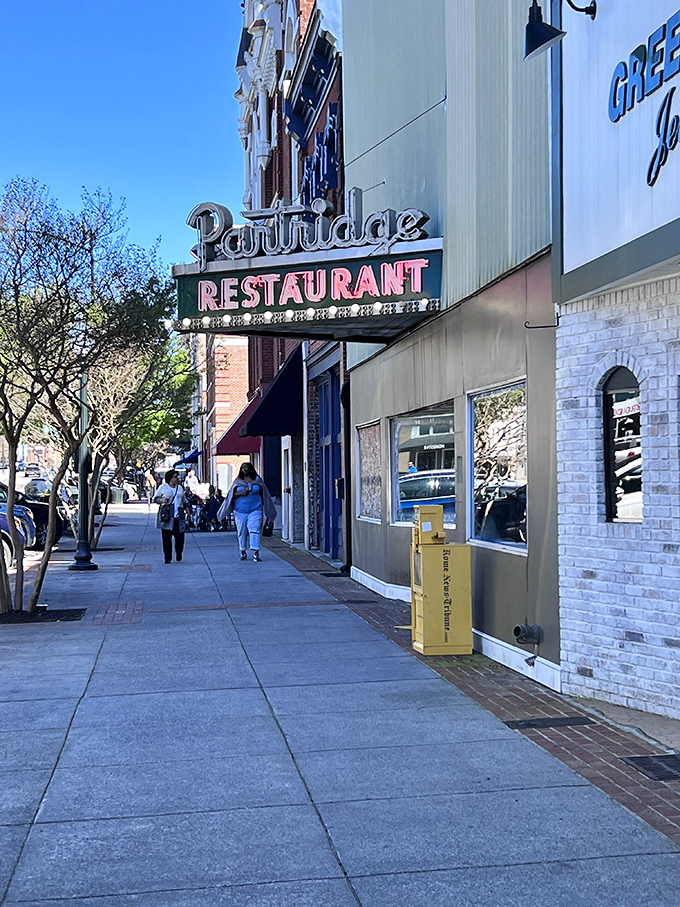 The Partridge Restaurant's vintage sign promises comfort food that's stood the test of time – where locals have been solving the world's problems over coffee for decades.