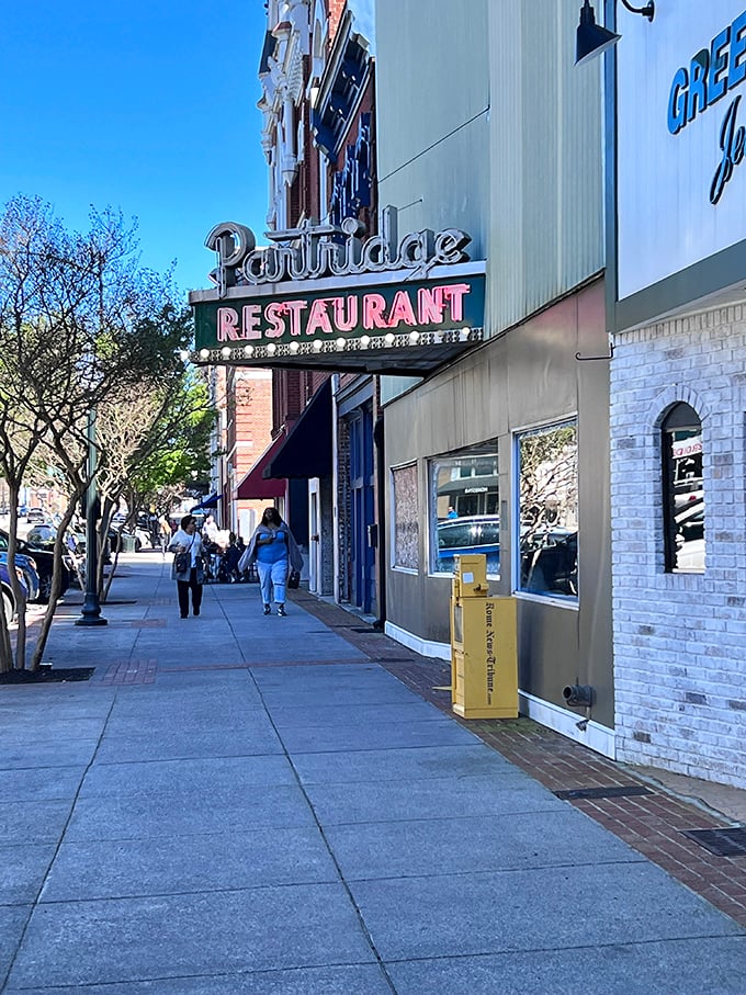 The Partridge Restaurant's vintage sign promises comfort food that's stood the test of time – where locals have been solving the world's problems over coffee for decades.