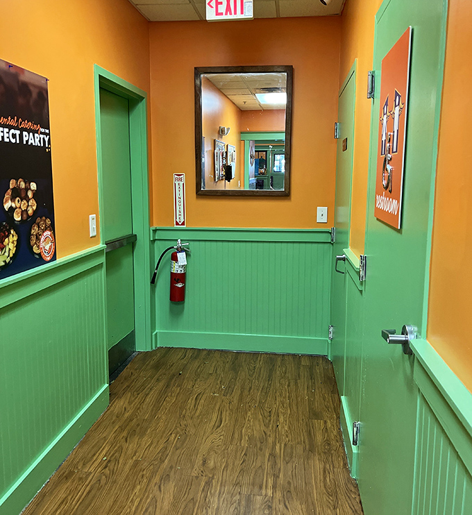 Even the hallway continues the cheerful color scheme—because at Flying Biscuit, even the path to the restroom should spark joy.
