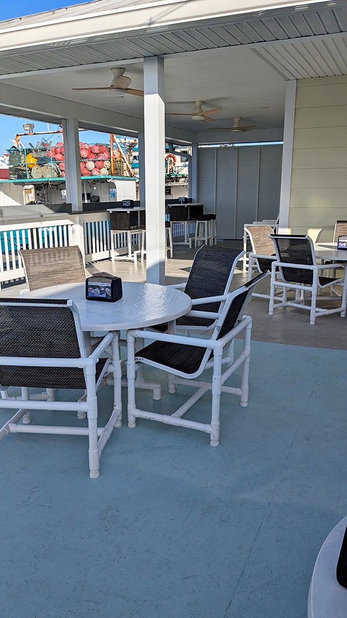 The covered patio offers front-row seats to Port Canaveral's working harbor. Ceiling fans keep the breeze flowing as steadily as the seafood from kitchen to table.