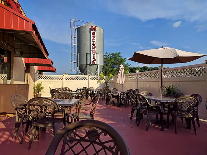 The outdoor patio offers a front-row seat to brewing magic, where umbrella-shaded tables whisper "stay awhile" even as the brewing tank hints at what's in your glass.