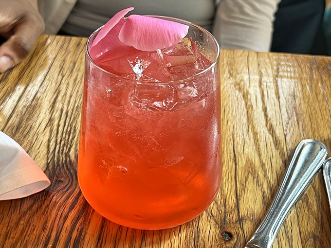 A cocktail so photogenic it belongs on a magazine cover, with a blush-pink hue that promises refreshment with Italian flair.