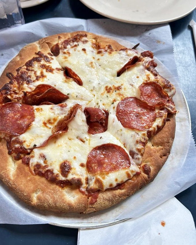 This pepperoni pizza doesn't need fancy toppings or artisanal pretensions—just perfectly melted cheese, zesty sauce, and pepperoni curled into little flavor cups.