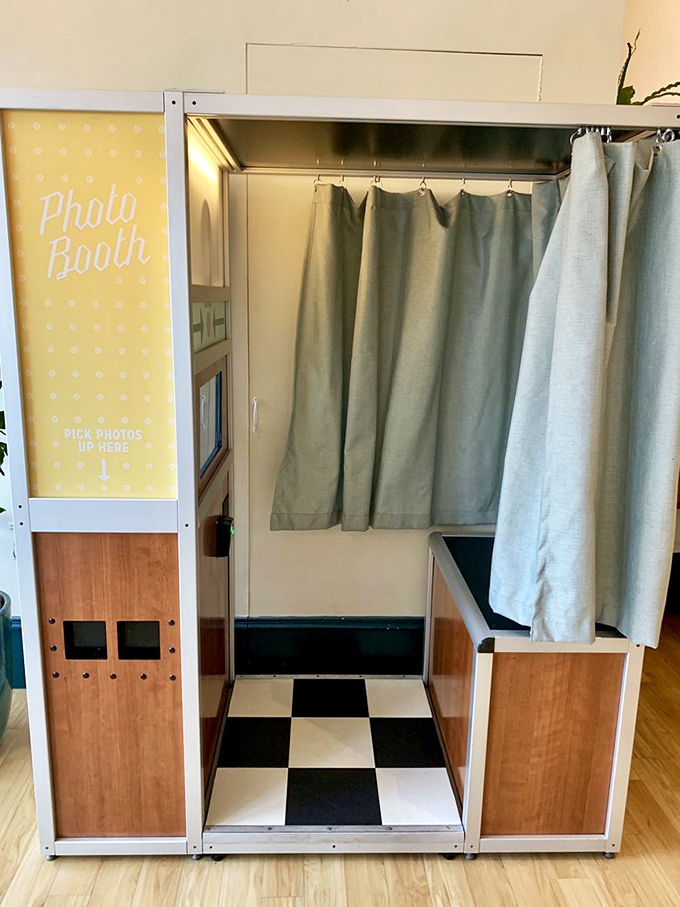 Even the photo booth is on-brand with its cheerful yellow signage and checkerboard floor—because breakfast this good deserves to be remembered.
