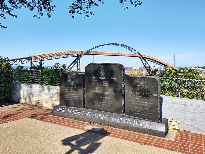 The American Merchant Marine Veterans Memorial stands in solemn tribute, with Ashtabula's magnificent lift bridge creating a perfect backdrop.