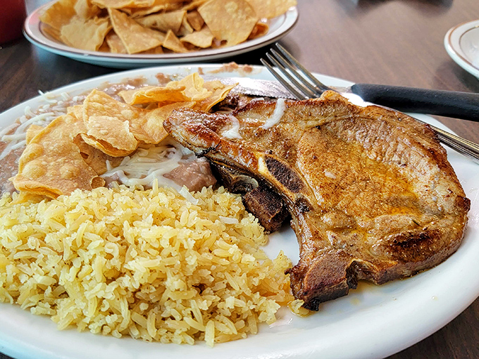 This pork chop plate with yellow rice isn't just a meal—it's evidence that Pat & Lorraine's mastery extends well beyond breakfast classics.