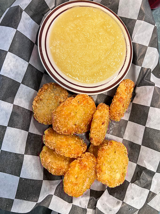 Golden-fried potato pancakes with applesauce—proof that sometimes the simplest combinations are culinary genius in disguise.