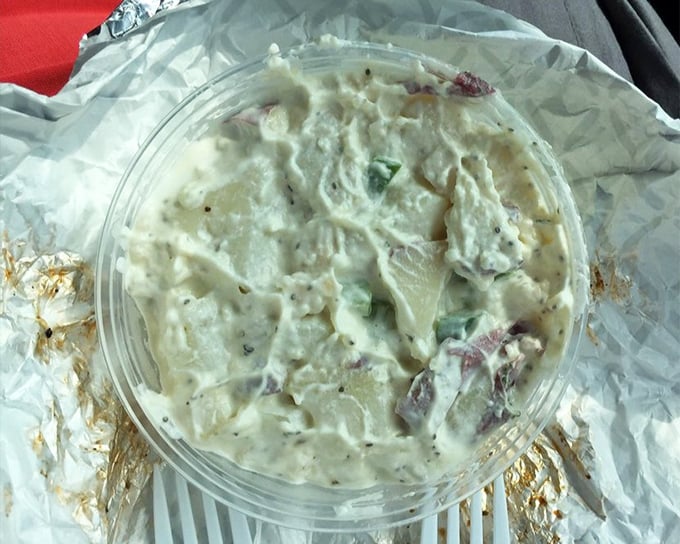 Potato salad that someone's grandmother would approve of—creamy, substantial, and clearly made by human hands rather than machines.