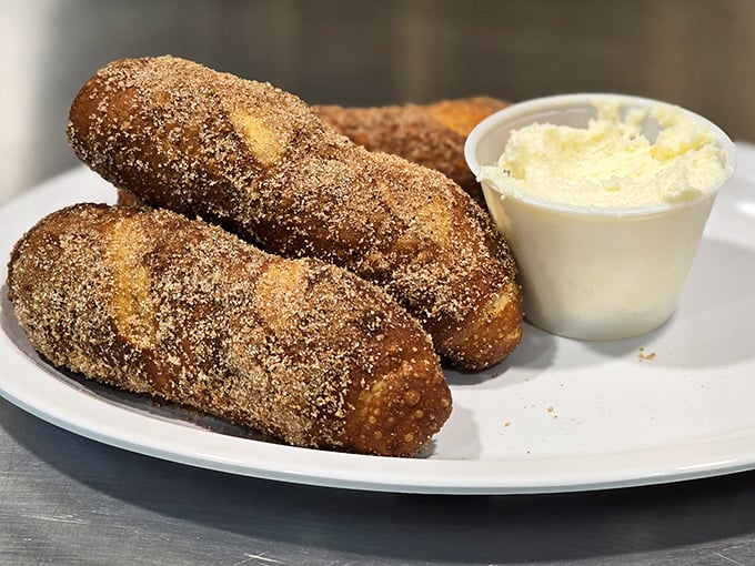 Pretzel logs that redefine the appetizer game—warm, cinnamon-sugar coated wands of joy that make you question why you'd ever save room for the main course.