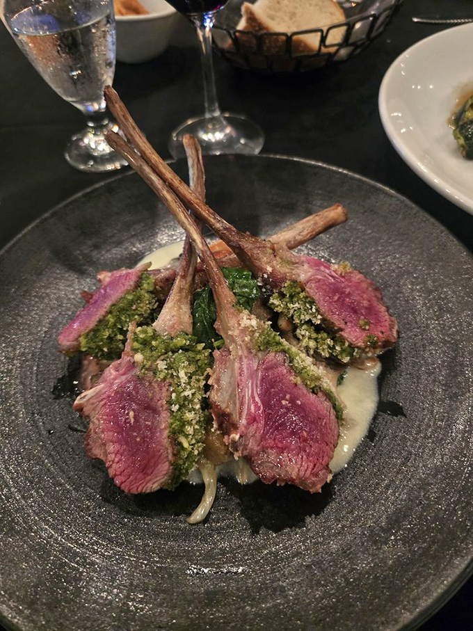 Rack of lamb wearing a verdant herb crust – meat transformed into art that's almost too beautiful to eat. Almost.