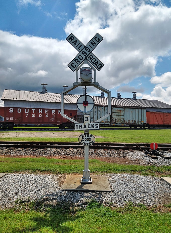 Stop, Look, Listen advises this classic railroad crossing sign, standing sentinel over tracks that still carry historic trains during the museum's special events.