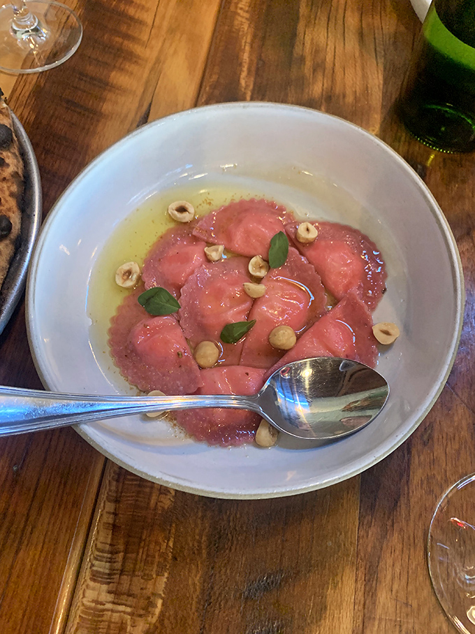 This isn't just pasta—it's edible art. The delicate ravioli bathing in broth with fresh herbs is the kind of simple perfection that's actually anything but simple.