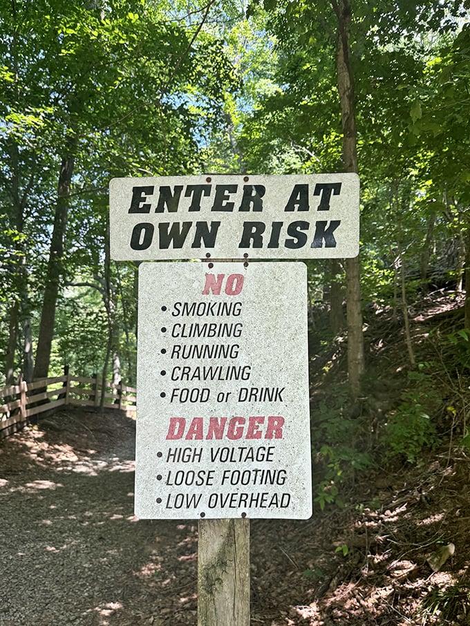 "Enter at own risk"—the sign that makes you wonder if they're warning about physical dangers or something altogether more supernatural.