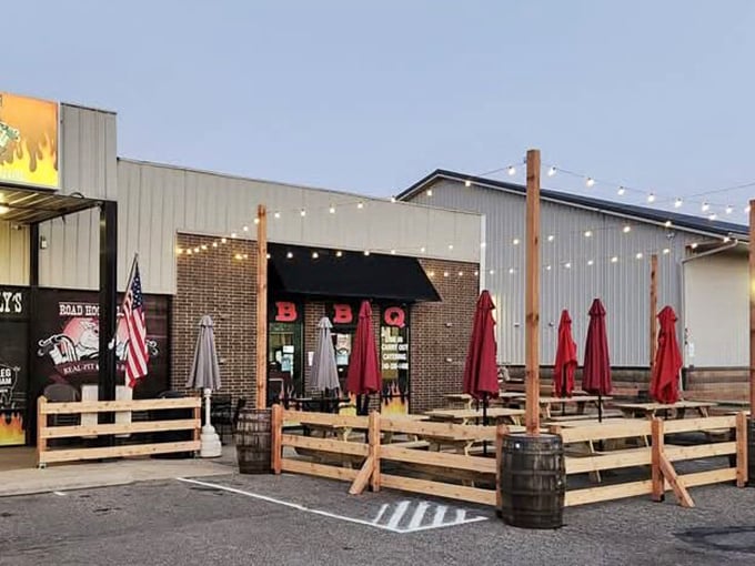 Road Hog Willy's outdoor seating invites you to savor smoky BBQ delights under string lights—because good food tastes even better with a side of fresh air.