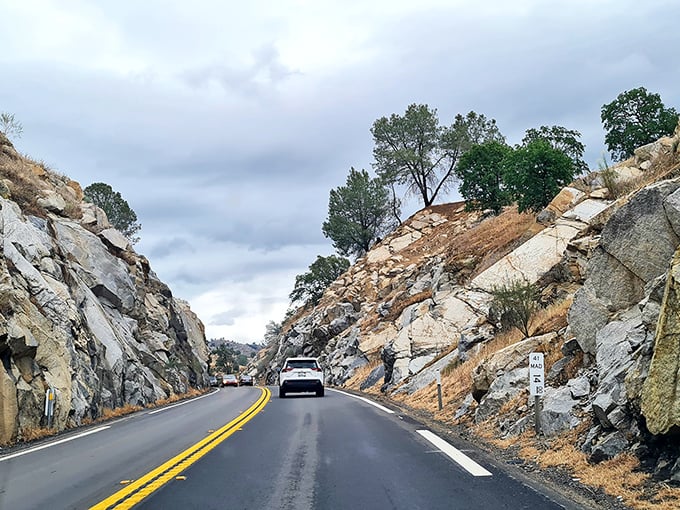 The road to Coarsegold cuts dramatically through ancient rock formations, a geological timeline you can drive through at 55 mph.