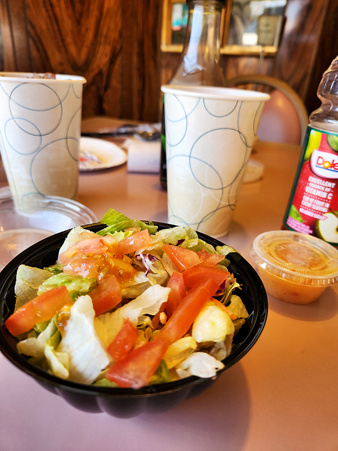 This salad isn't trying to win awards or impress food critics—it's just doing its honest job of providing something green before the main event arrives.