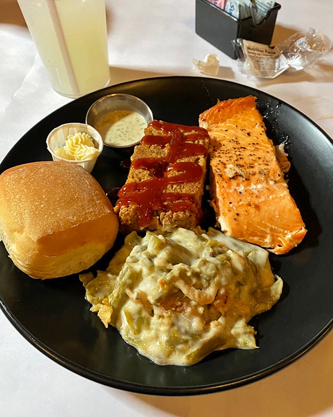 Salmon, chicken, and potatoes sharing a plate like old friends at a reunion – comfort food that doesn't need fancy plating to impress.