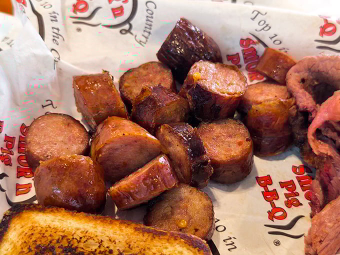 Sausage slices glistening with smoky goodness—each bite delivering that perfect snap followed by juicy, spiced perfection. Meat candy for grown-ups.