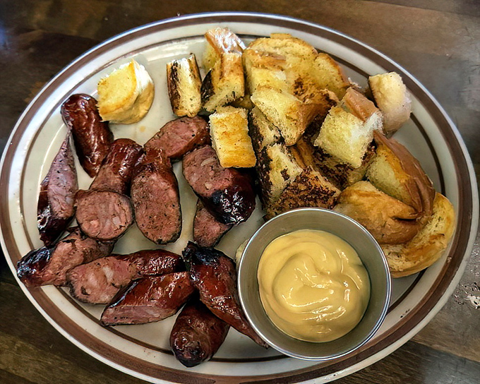 Linguica sausage—the Portuguese contribution to California cuisine that deserves more recognition. Sliced and grilled to snap-worthy perfection alongside buttery toast points.