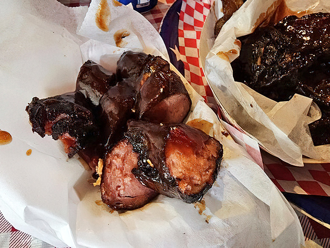 Sausages glistening like edible jewelry – each link a promise of smoky, savory satisfaction.