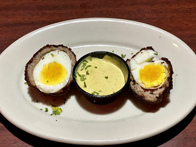 Scotch eggs: where breakfast meets engineering. Perfectly soft yolks encased in savory armor—Scotland's gift to hungry Americans everywhere. 