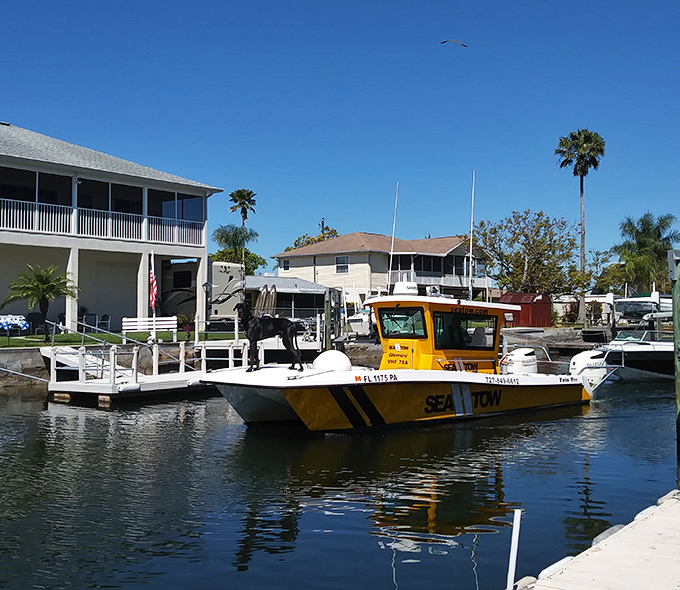 Sea Tow's bright yellow rescue boat stands ready—because even in paradise, sometimes your boat decides it's taking the day off.