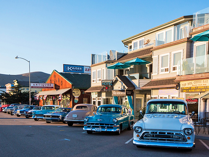 Classic cars line Ocean Avenue like a time-traveling car show where every chrome bumper reflects simpler, shinier times.
